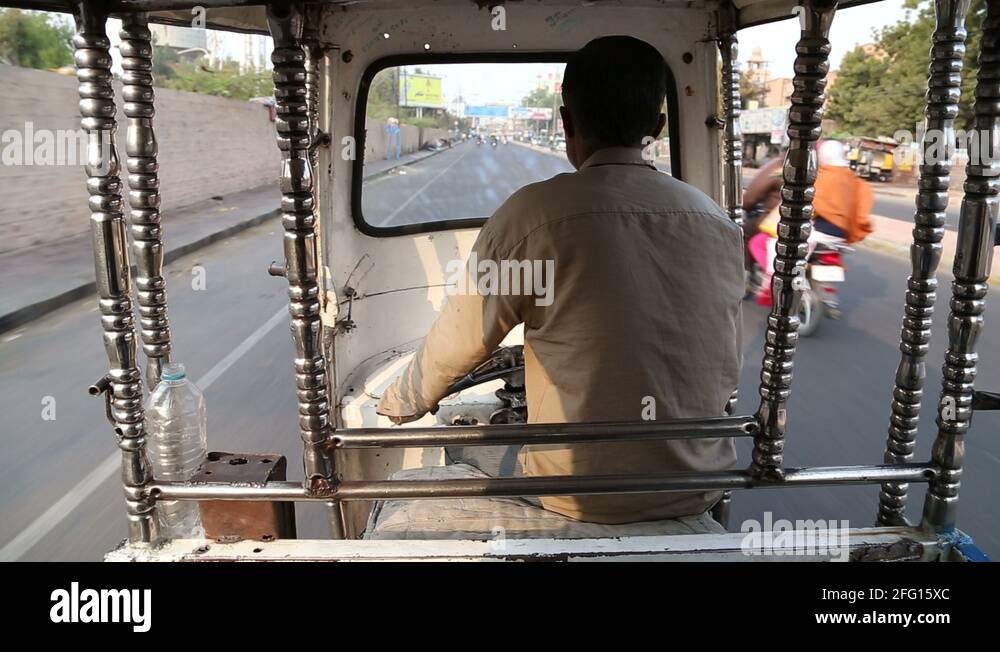 Back view of rickshaw driver during the ride through street in Jodhpur ...