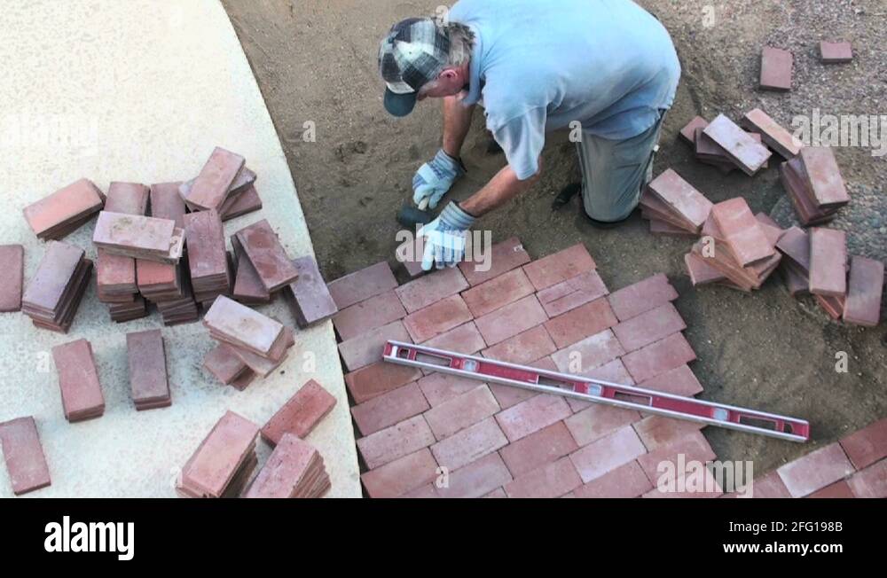 Leveling pavers Stock Videos & Footage - HD and 4K Video Clips - Alamy