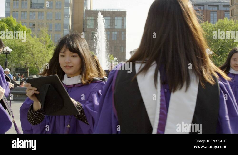 NYU Washington Square Park female Asian graduates cap and gown slow ...