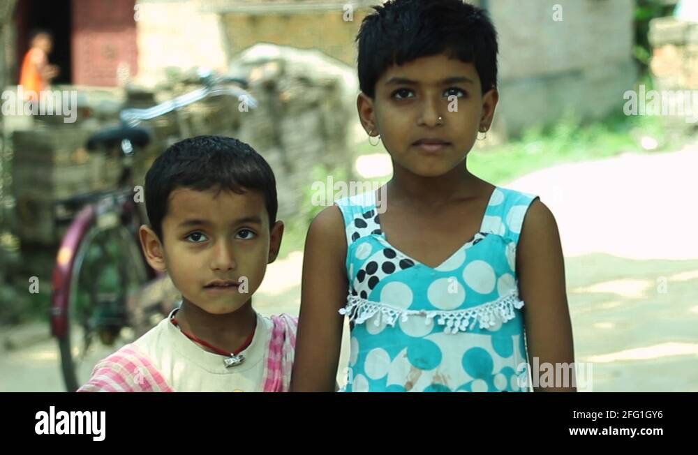 Kids in village in India laughing and smiling together. Narrow depth of ...