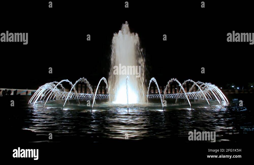 Static shot of the illuminated fountain at the World War II Memorial at ...