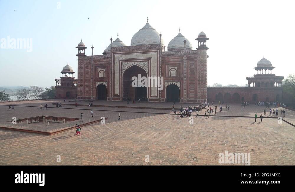 Back side view of Taj Mahal, with tourists through pation in front ...