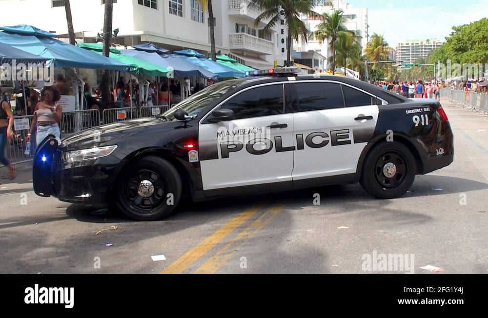 Miami Police car with emergency lights activated at the Ocean drive ...