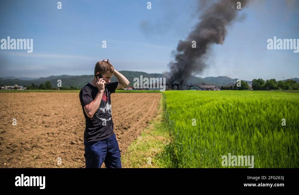 Man panic after building on fire Stock Video Footage - Alamy