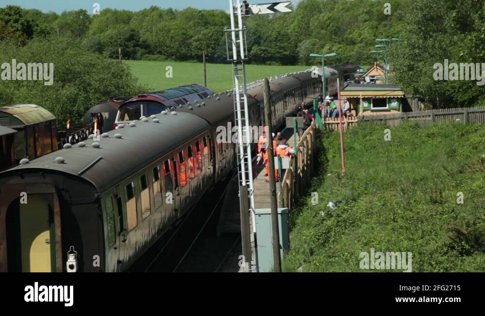 Old English diesel train and carriages leave station Stock Video ...