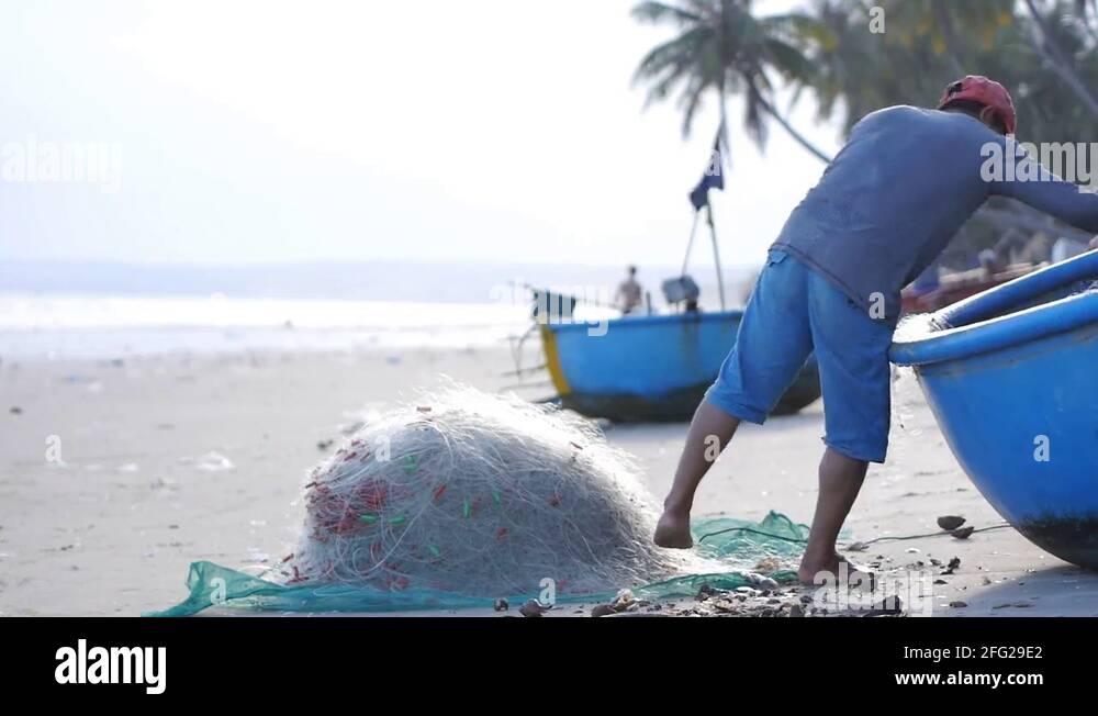 Fisherman cleaning his catch Stock Videos & Footage - HD and 4K Video ...