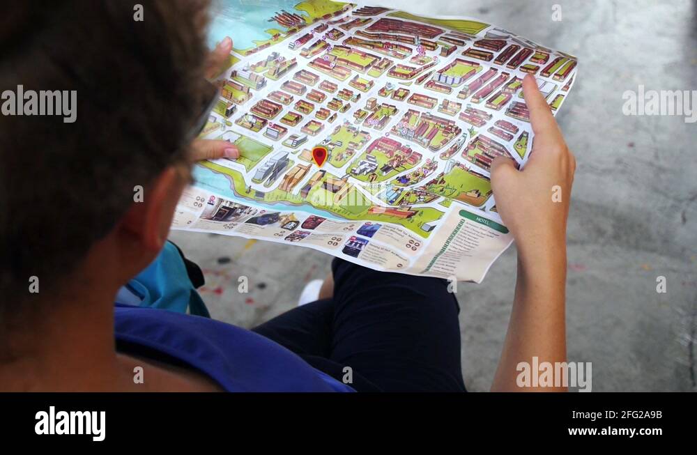 Female Tourist holding Interactive City Map. Animation map icons show ...
