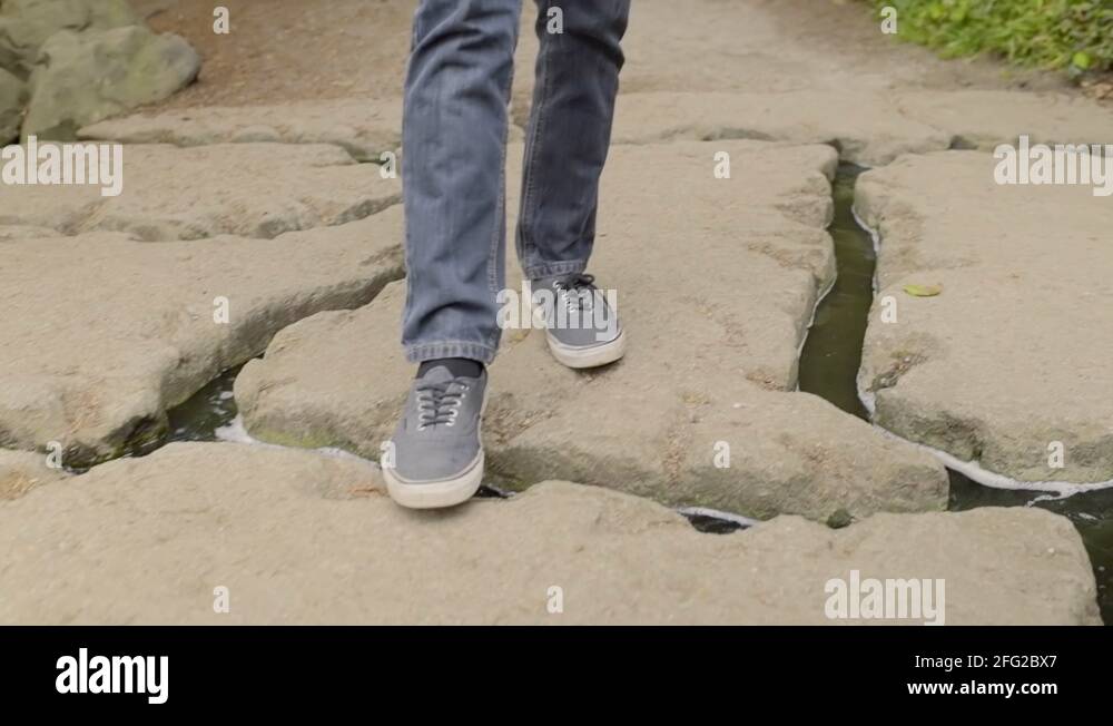 Stepping stone path feet Stock Videos & Footage - HD and 4K Video Clips ...