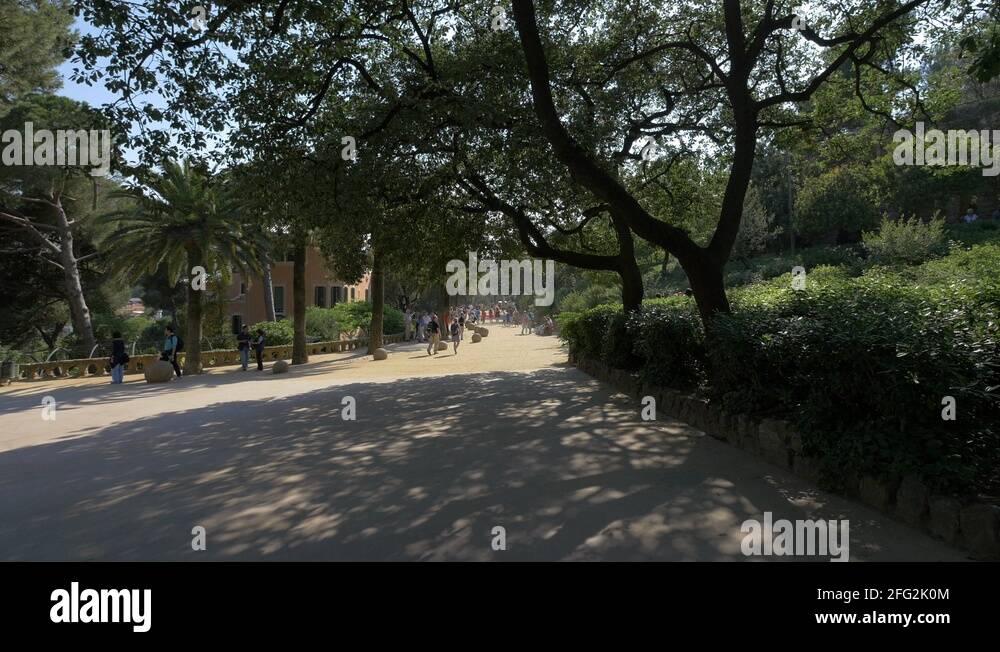 Tourists walking near the Gaudi house and museum in Parc Guell ...