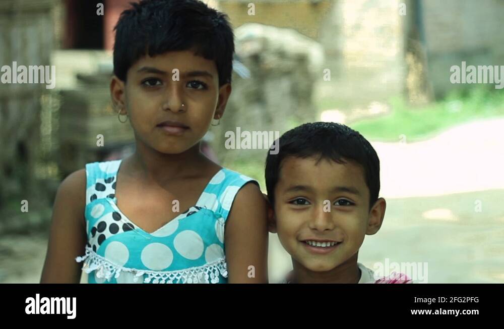 Kids in village in India laughing and smiling together. Narrow depth of ...