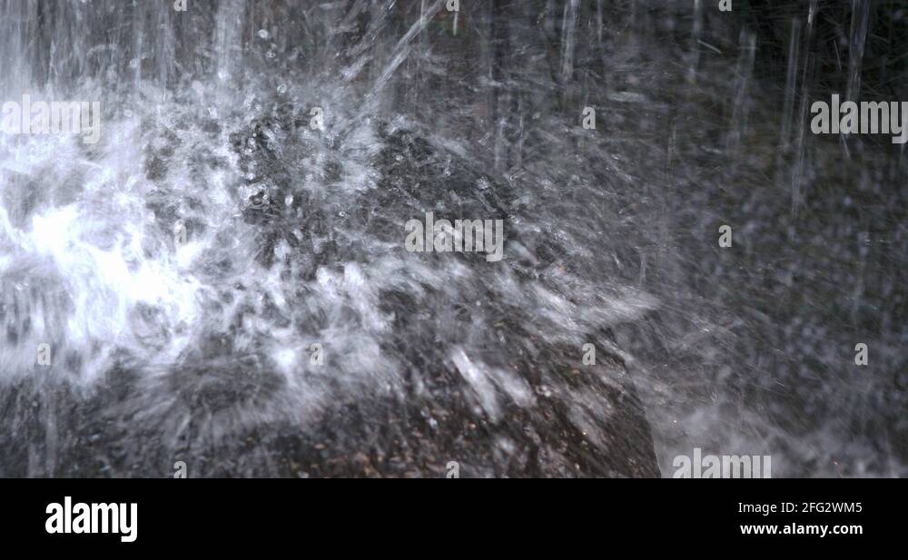 Water falling and hitting rock in nature 4k Stock Video Footage - Alamy