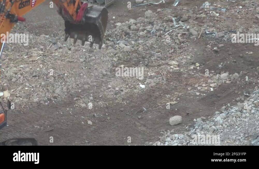 ULTRA HD 4K Closeup excavator machine work construction site debris ...