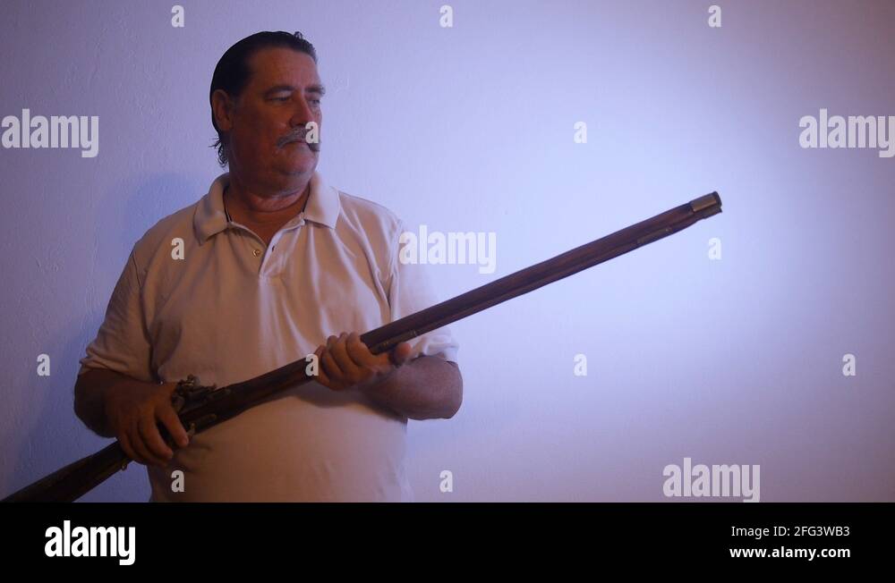 MAN WITH OLD MUSKET rifle gun replica Stock Video Footage - Alamy