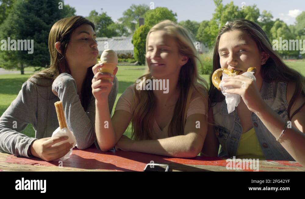Teenage Girls Sit, Eat Snack Foods, They Smile And Laugh, Then Leave ...