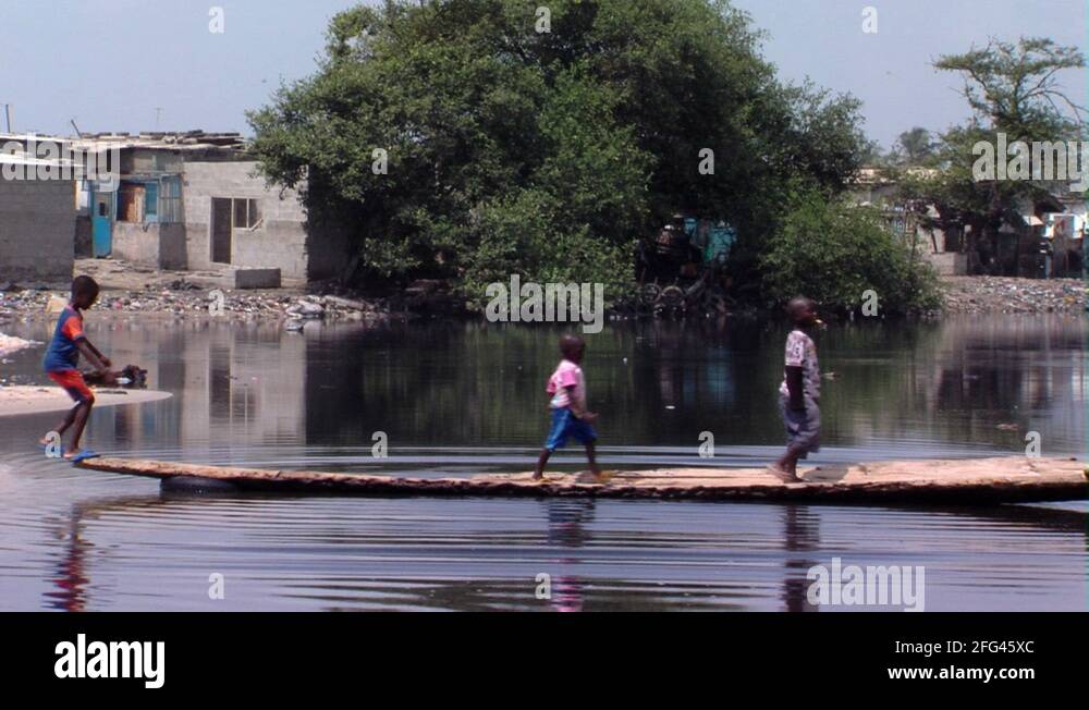 Kids on a floating bridge in Africa Stock Video Footage - Alamy