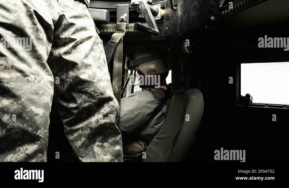 Shot in a Humvee up at the turret gunner then to driver Stock Video ...