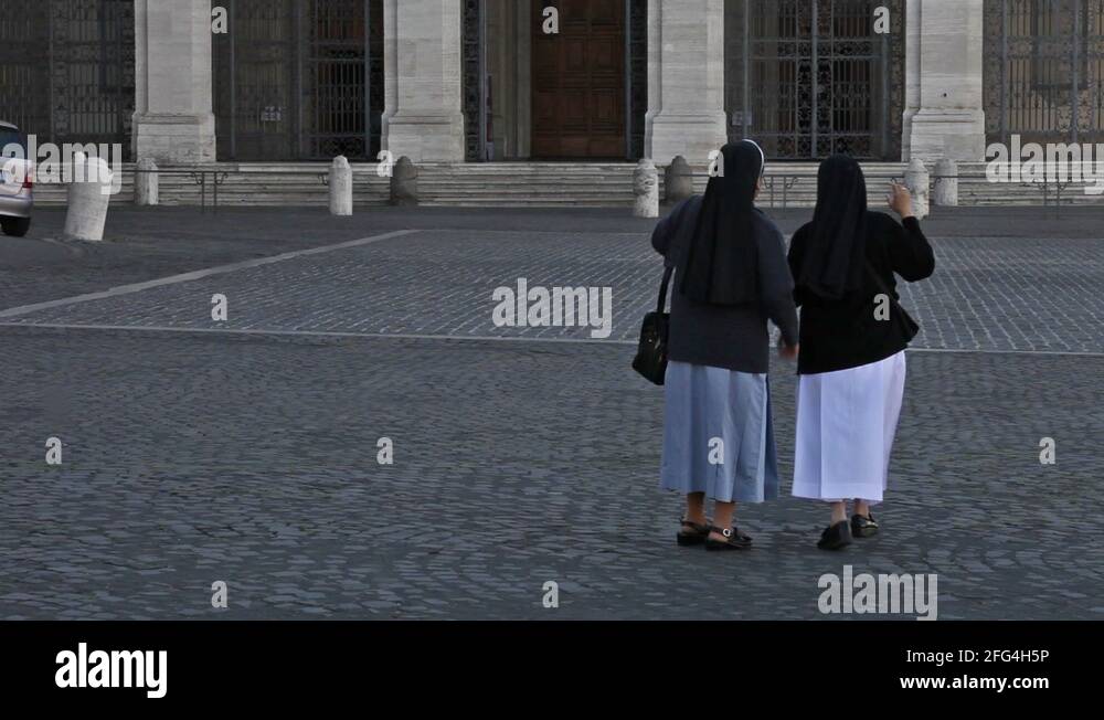 A nun poses for a picture in Piazza San Giovanni Stock Video Footage ...