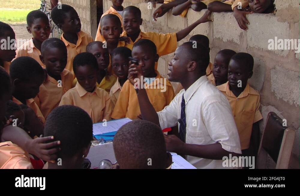 Teacher teaching children in Africa Stock Video Footage - Alamy
