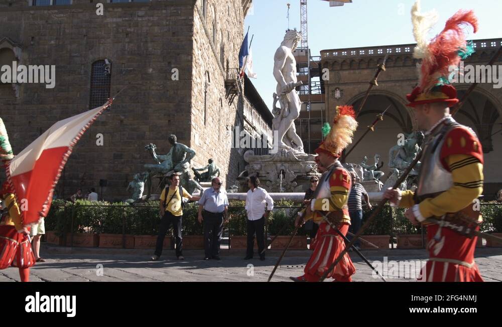 Men in fancy attire carrying flags in a parade in Italy Stock Video ...