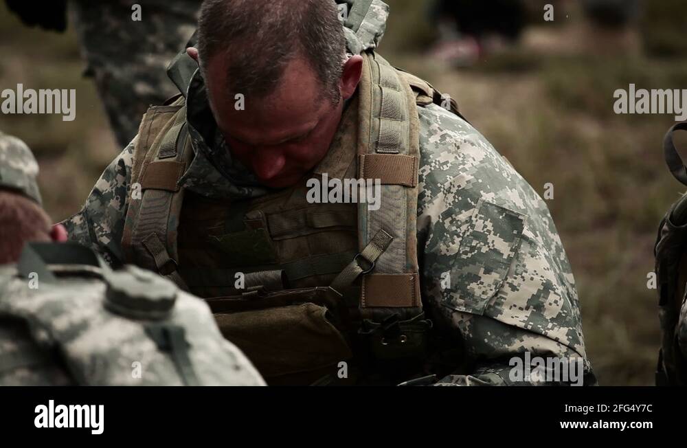 Assault rifle being loaded by soldiers Stock Video Footage - Alamy