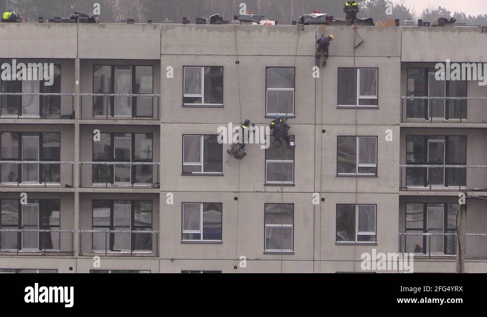 builder work with special mechanism house at construction site Stock ...