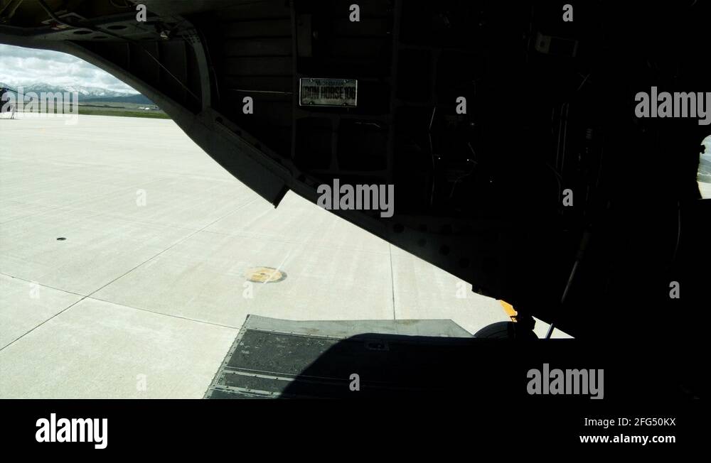 Footage from the back hatch of a Chinook helicopter at an airfield ...