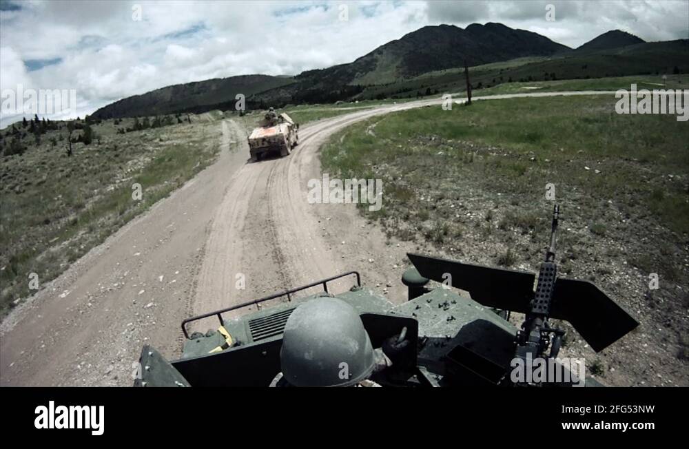 Soldier shoots humvee machine gun while tank is in motion Stock Video ...