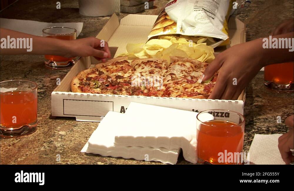 Grabbing pizza Stock Videos & Footage - HD and 4K Video Clips - Alamy