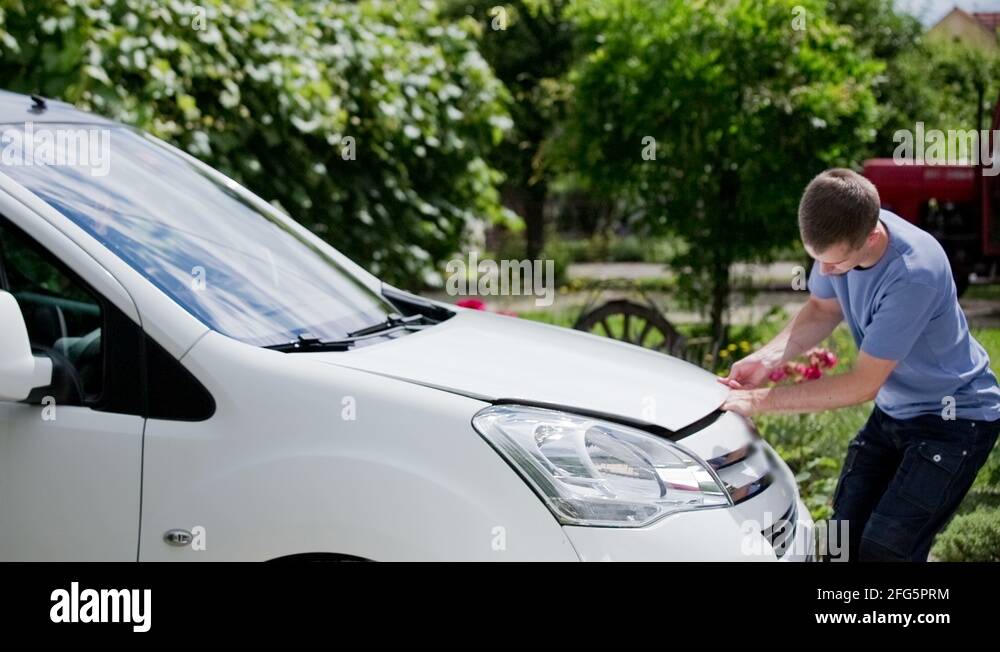 Man car bonnet Stock Videos & Footage - HD and 4K Video Clips - Alamy