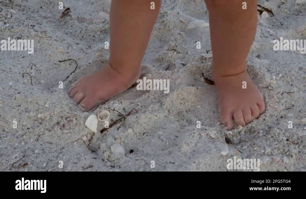 Tilt Up from Toes in Sand to Cute Little Girl on the Beach, 4K Stock ...