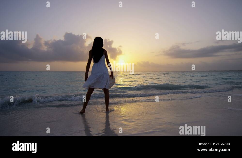 Beautiful Asian Chinese girl wearing white sundress on beach Stock ...