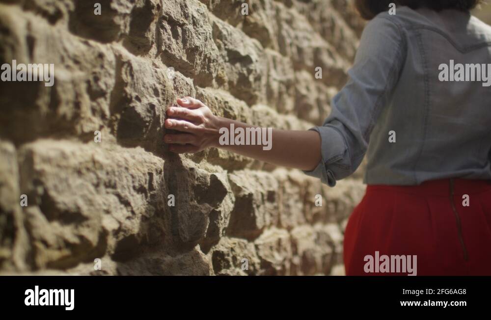 Girl walking along wall Stock Videos & Footage - HD and 4K Video Clips ...