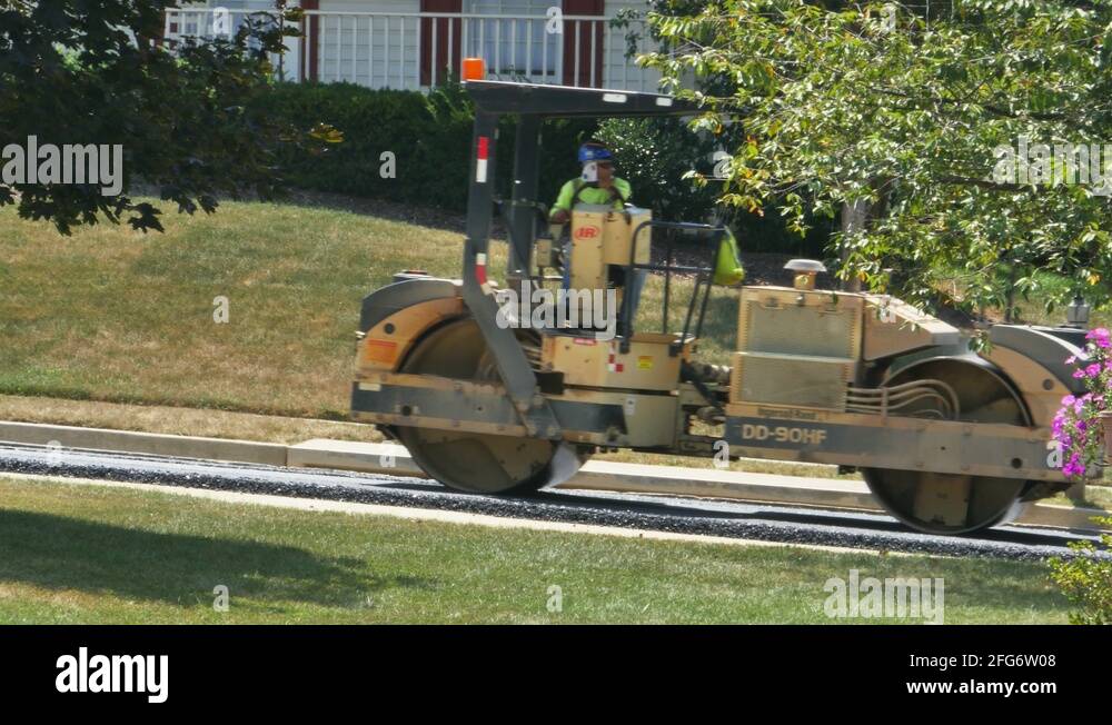 Construction Works Paving Asphalt Road in Neighborhood, 4K Stock Video ...