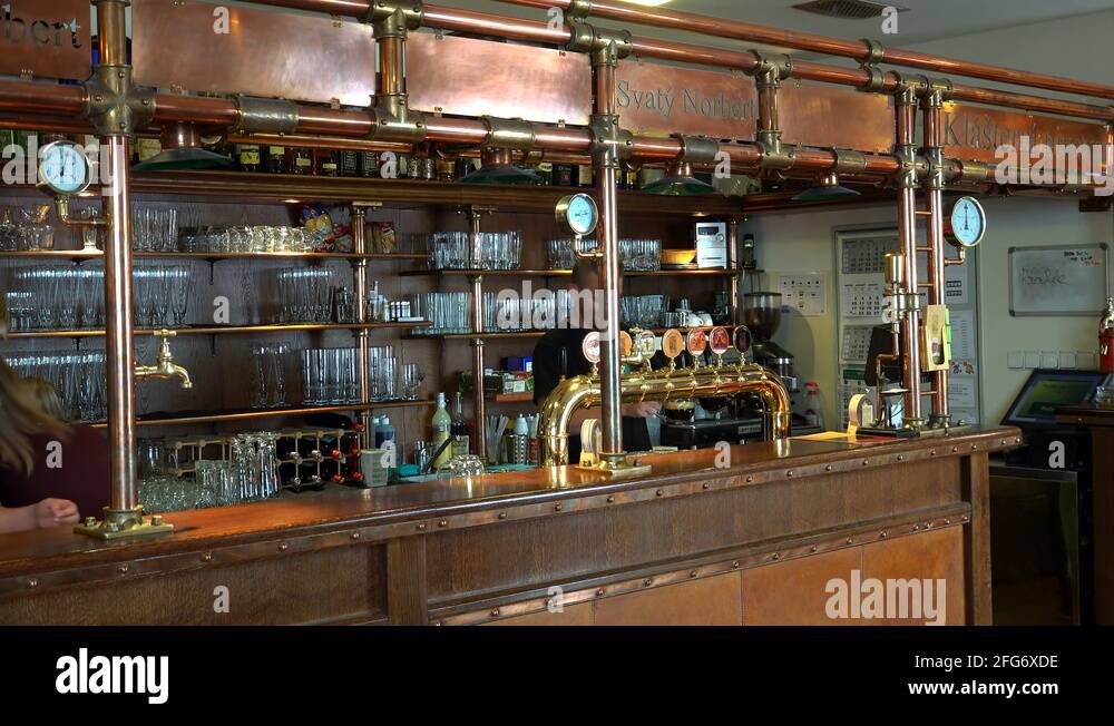 Barman at the bar desk of the 'St. Norbert ' pub in Strahov Monastery ...