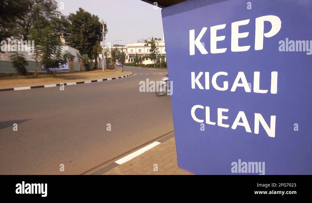 'Keep Kigali Clean' sign with cars, motorbikes, motorcycles driving ...