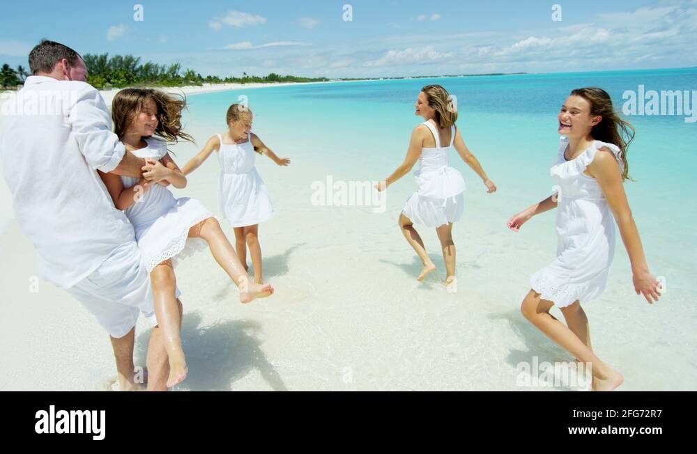 Caucasian parents and their young daughters on a Caribbean beach Stock ...