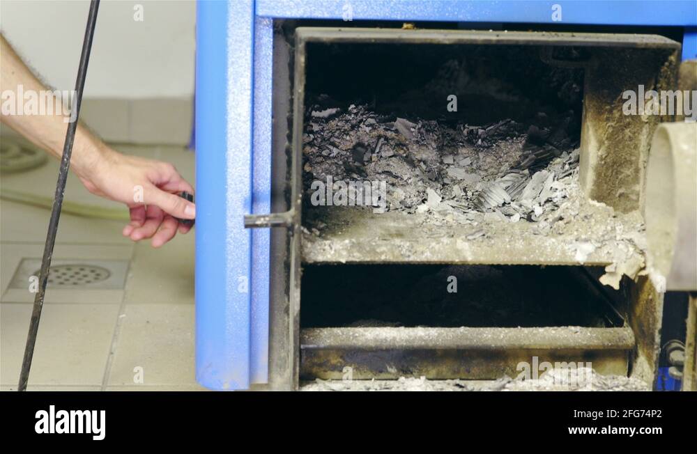 Pushing out and in a grid to remove ash in furnace 4K Stock Video ...