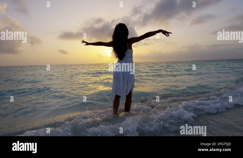 Beautiful Asian Chinese girl wearing white sundress on beach Stock ...