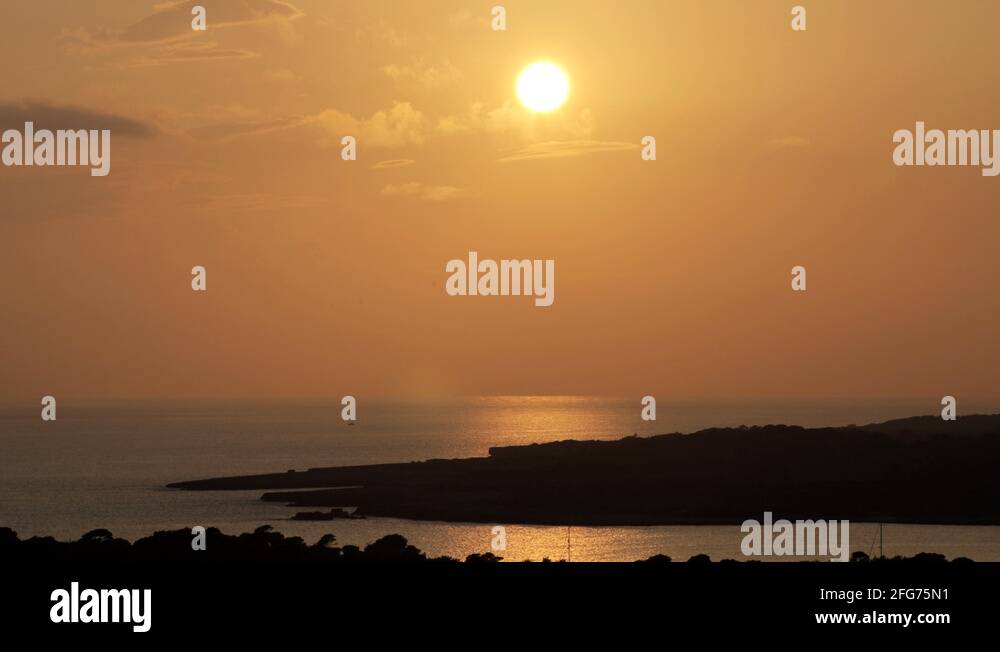 sunset menorca sky clouds Stock Video Footage - Alamy