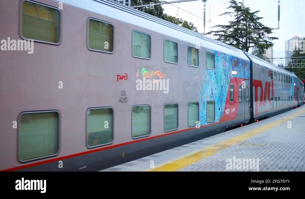 Two-storey train arrives. Cars are made in Tver Carriage factory Stock ...