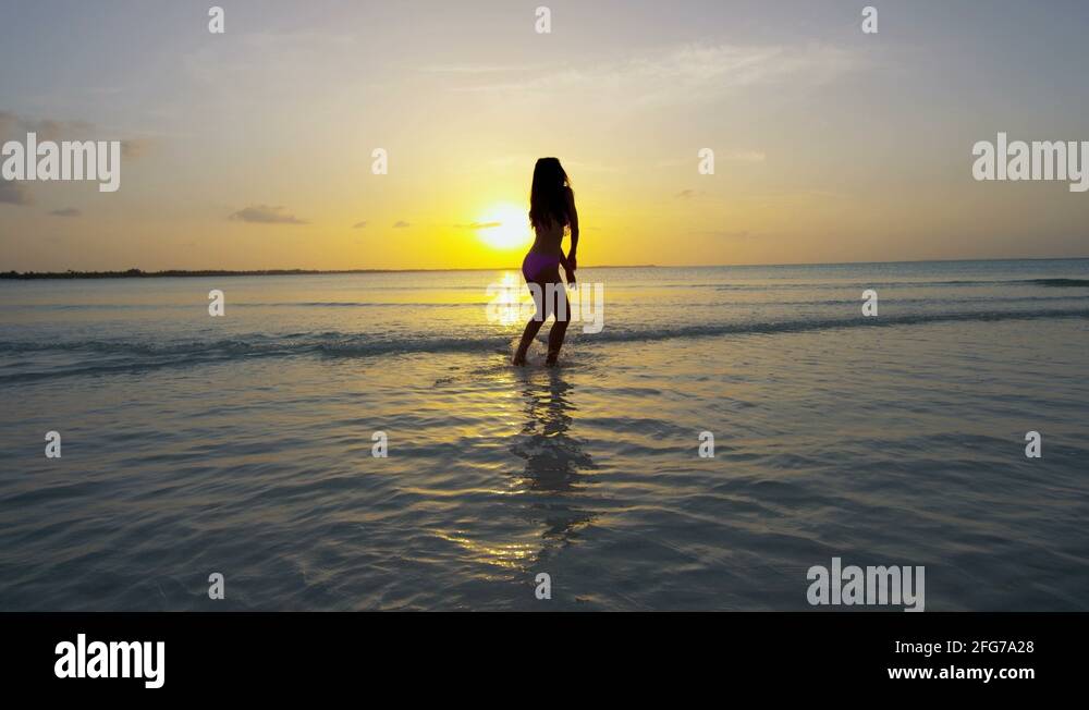 Young Asian Chinese girl in swimwear on ocean beach resort Stock Video ...