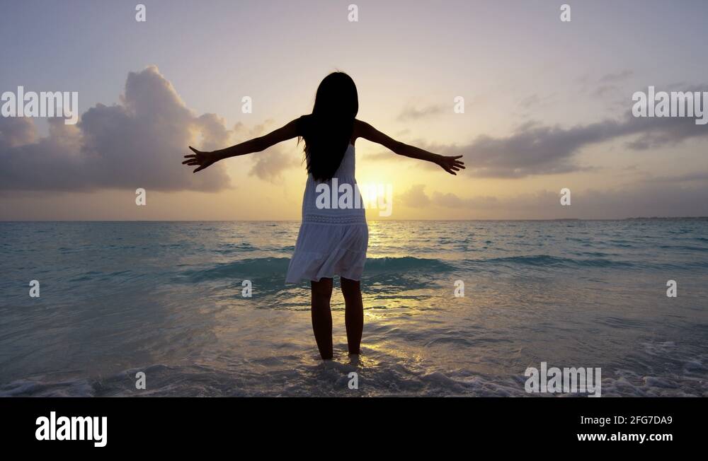 Beautiful Asian Chinese girl wearing white sundress on beach Stock ...