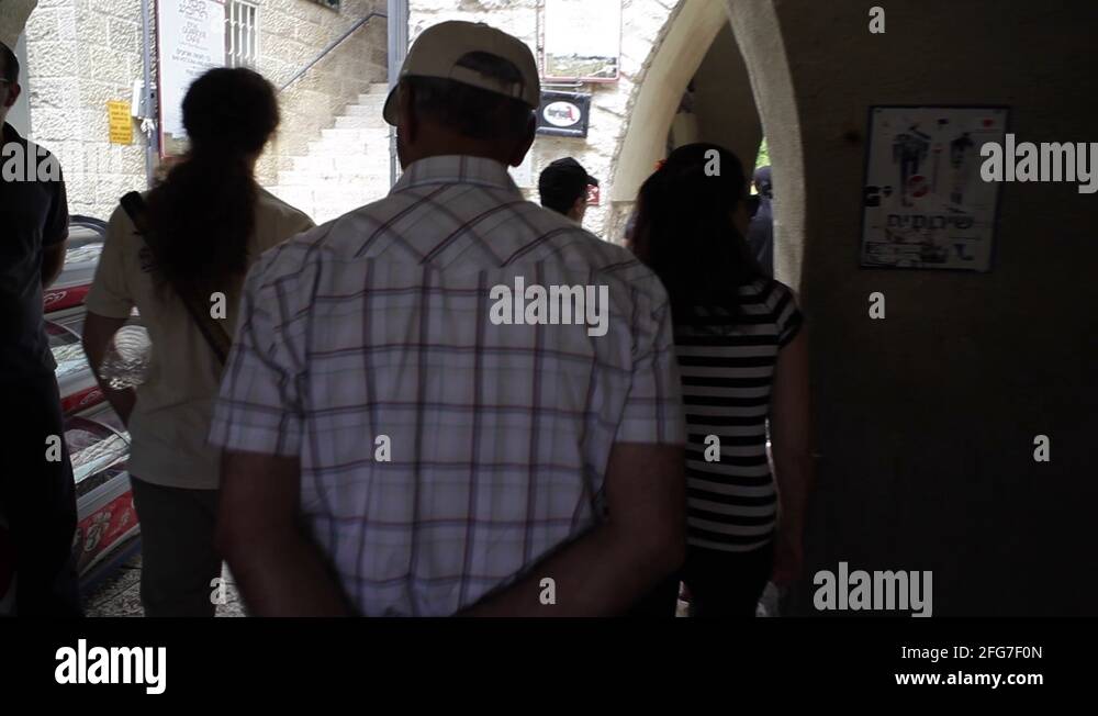 People walk to the wailing wall, Jerusalem alleyways, Israel Palestine ...