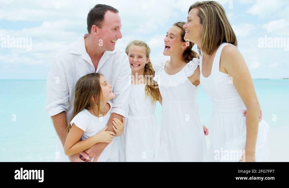 Caucasian parents and their young daughters on a Caribbean beach Stock ...