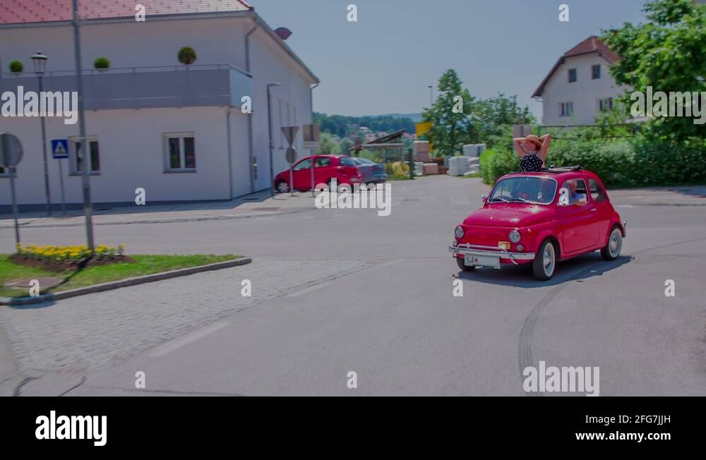 Driving around town in a red yugo Stock Video Footage - Alamy