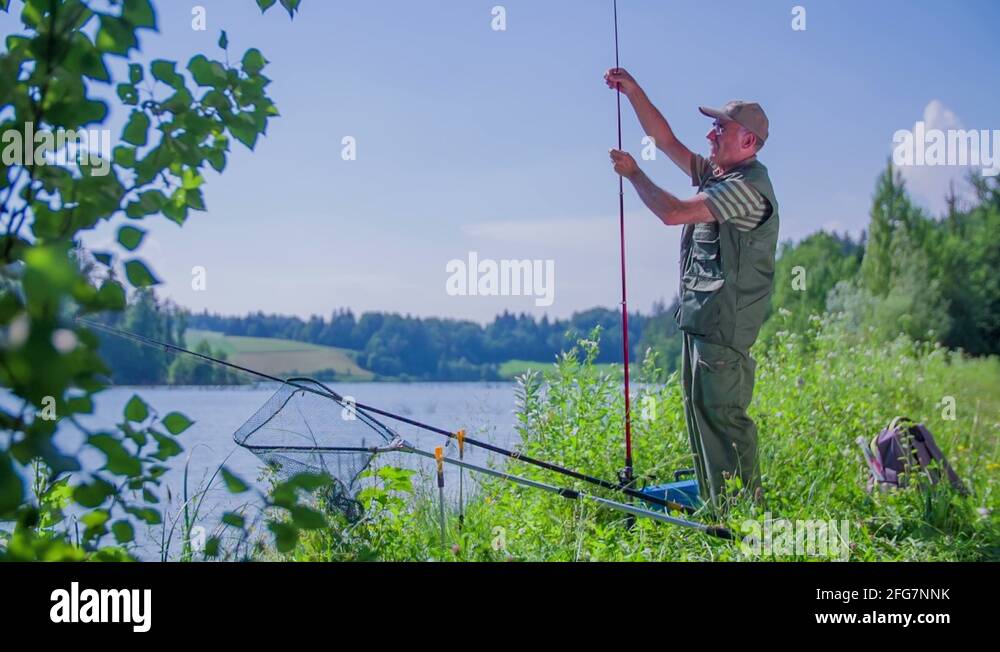 Fisherman is slowly putting down his fishing rod Stock Video Footage ...