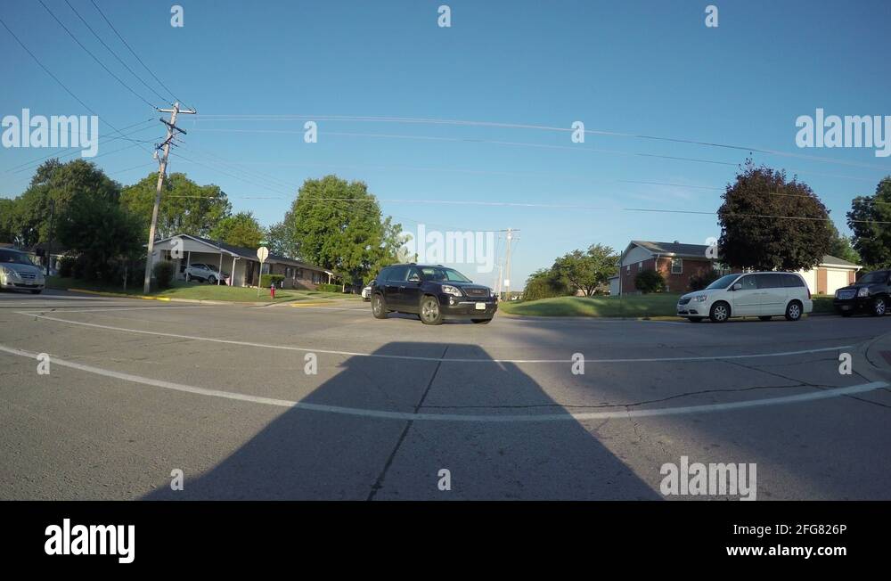 Busy 4 way intersection POV suburban school morning drop off Stock ...