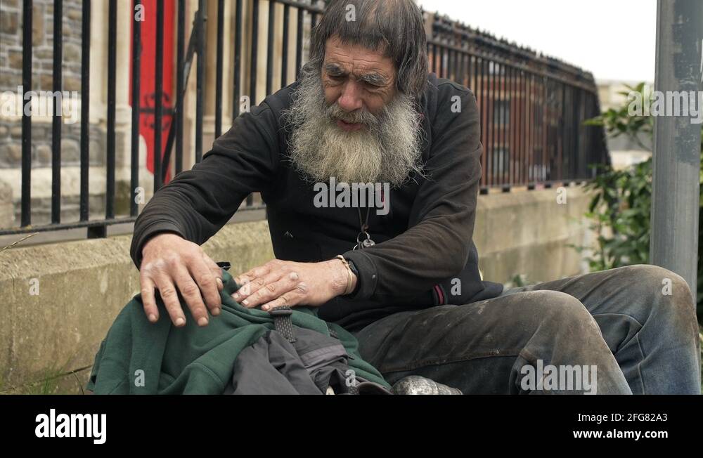 old man homeless sleeping in the street: elderly poor man Stock Video ...