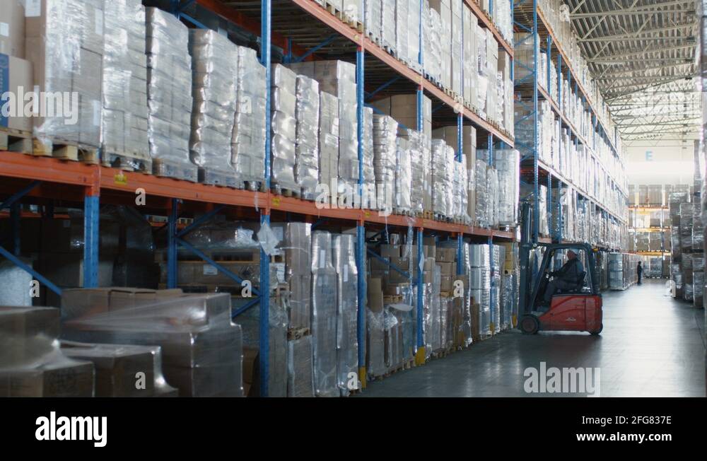Forklift Loader is Moving Cargo Goods in Logistic Warehouse Stock Video ...