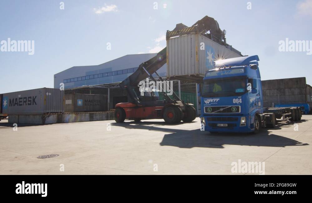 Container Handler is Loading Container onto Truck in Logistic Center ...